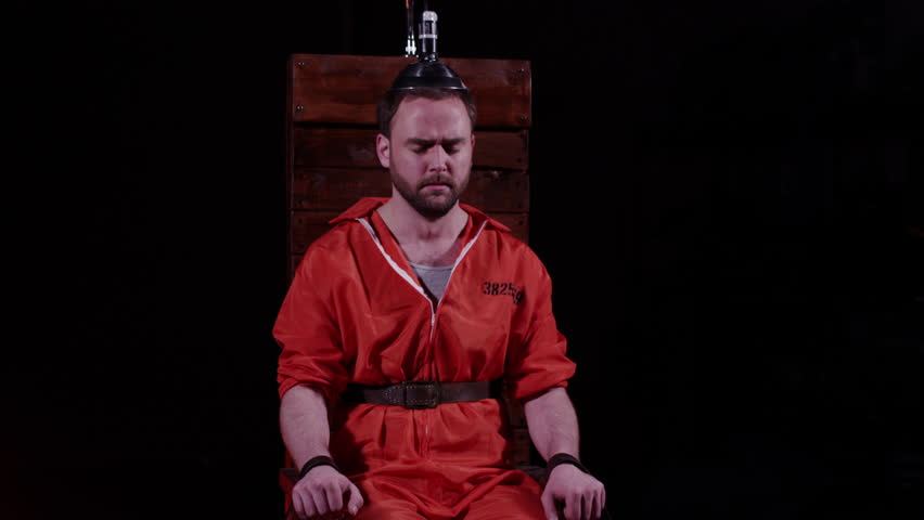 Capital Punishment - Electric Chair - Male Prisoner Sitting In Chair ...