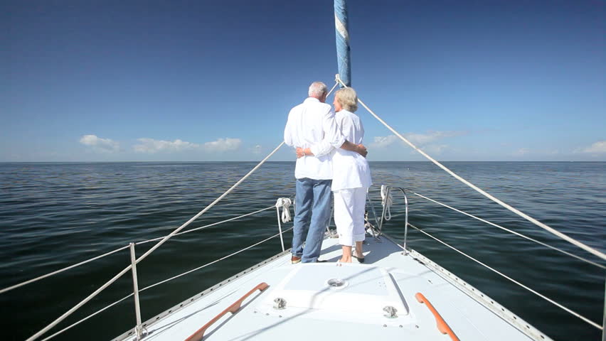 Healthy Retired Couple Enjoying Leisure Aboard Their Luxury Sailing ...